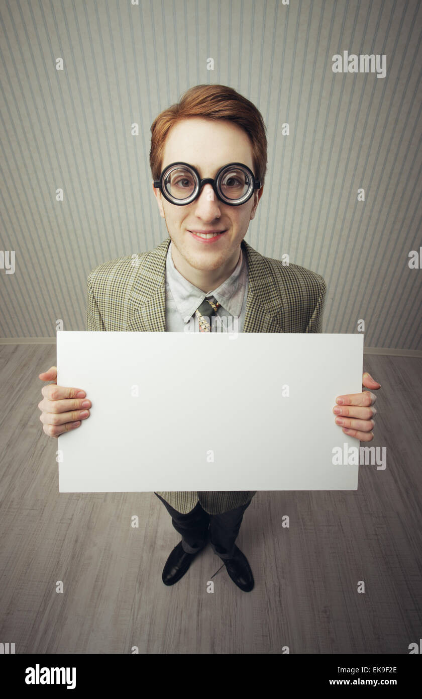 Business man nerd holds a blank sign Stock Photo - Alamy