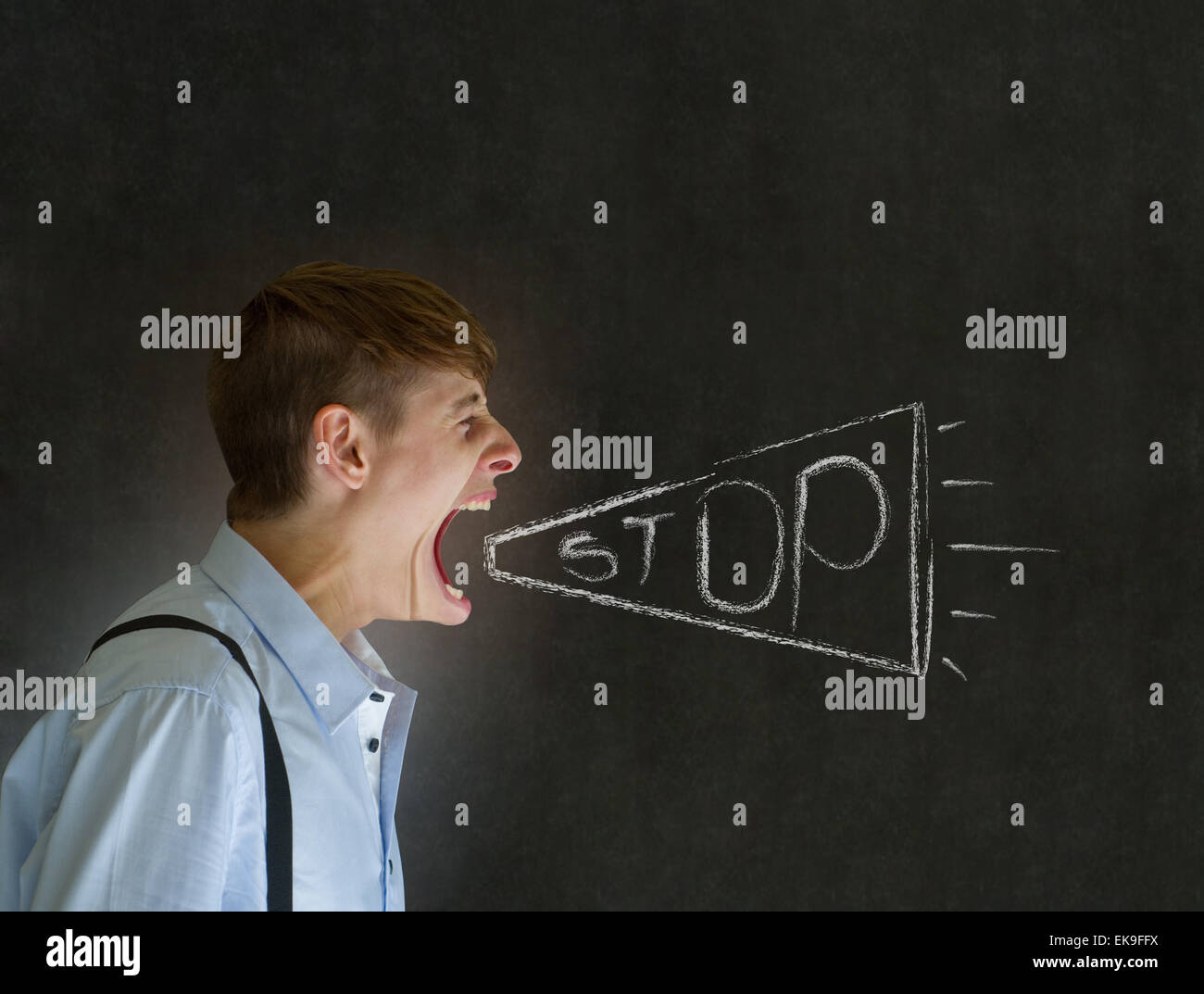 Angry man shouting stop through chalk megaphone blackboard background ...