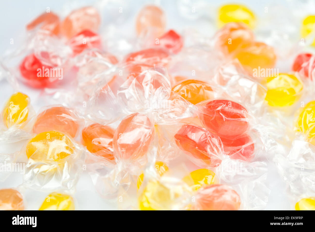 background of multi-colored candies in shiny wrappers Stock Photo - Alamy