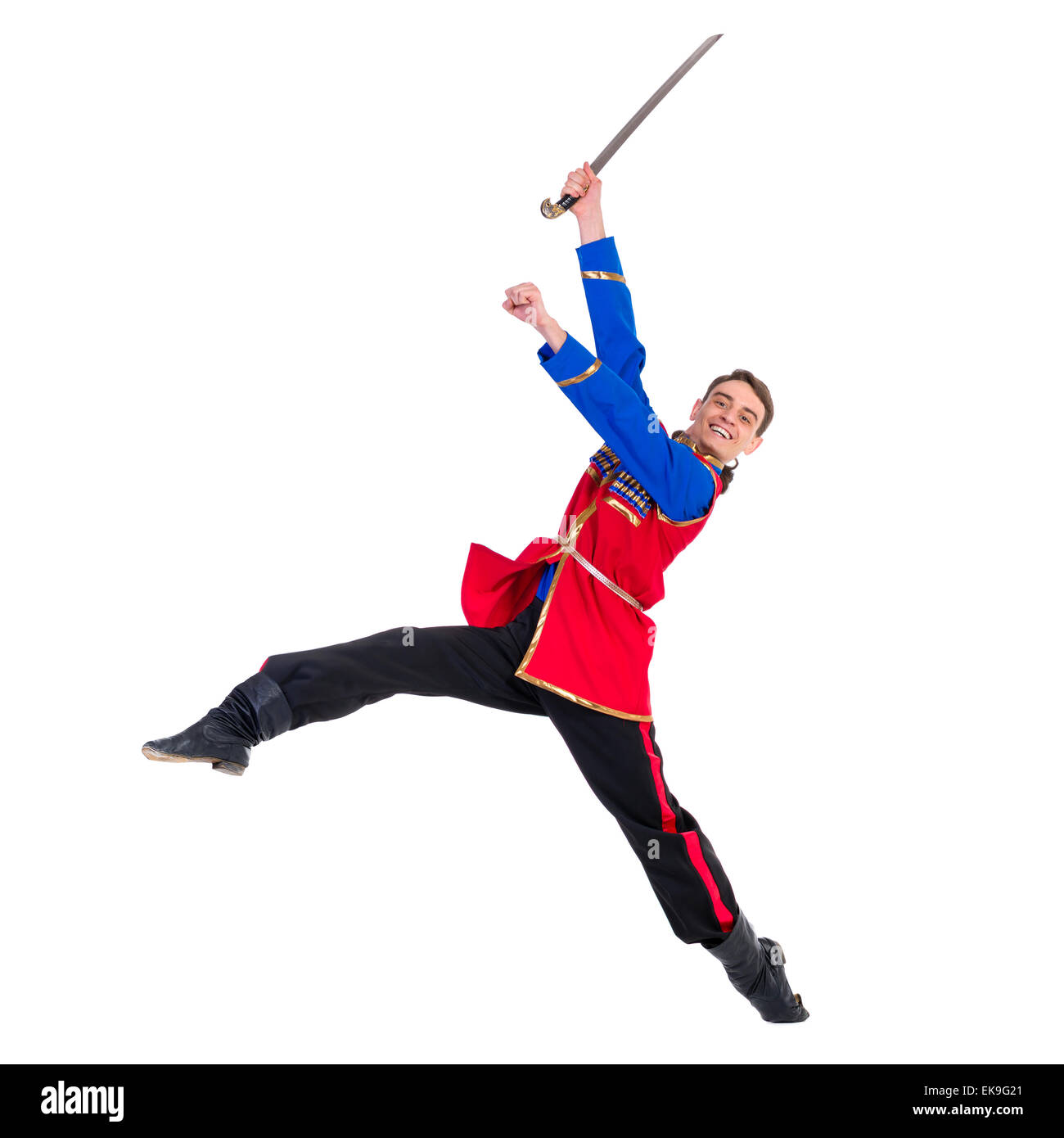 Russian cossack dance. Young dancer posing with sword Stock Photo - Alamy