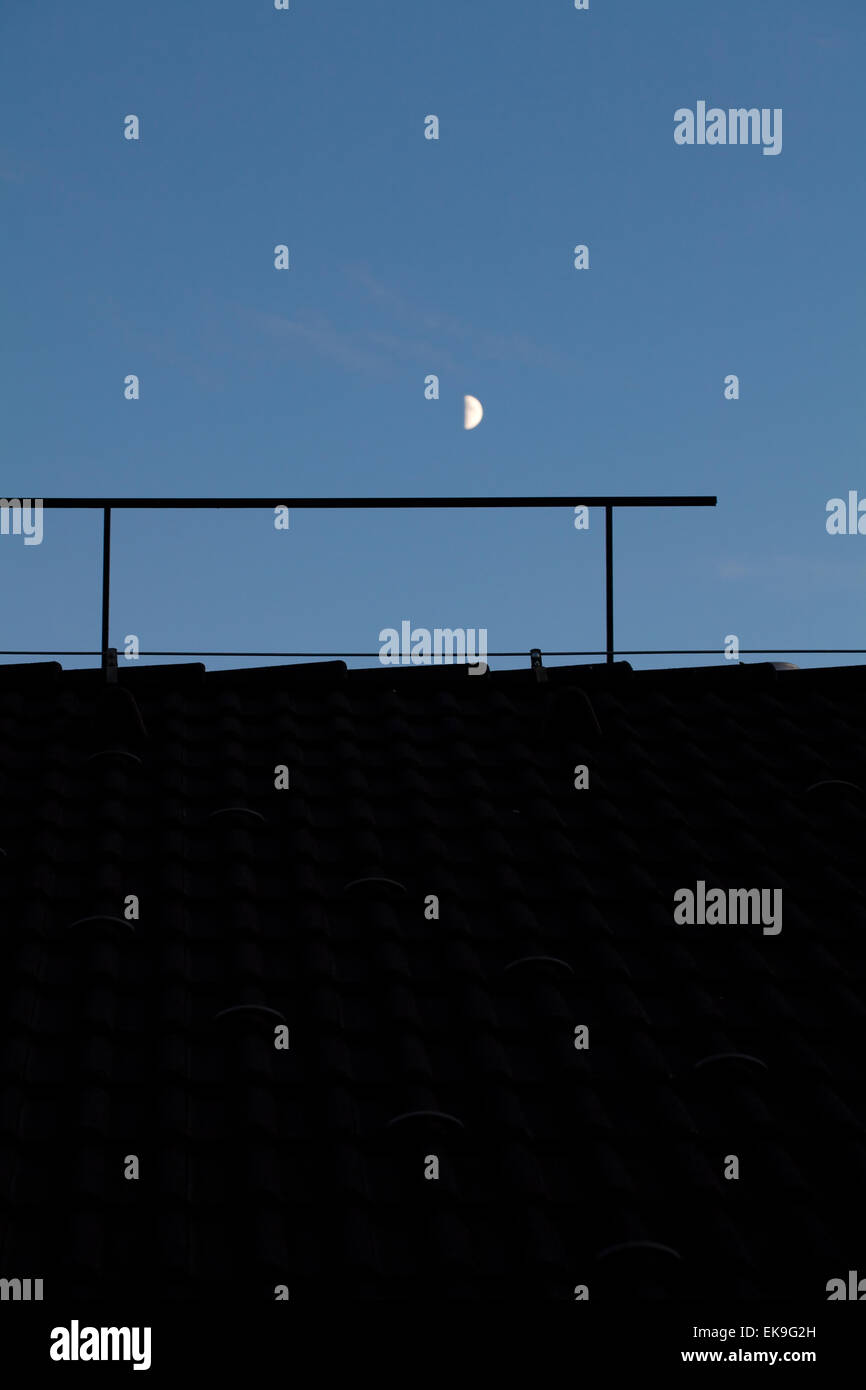 moon in the night sky above the roof Stock Photo - Alamy