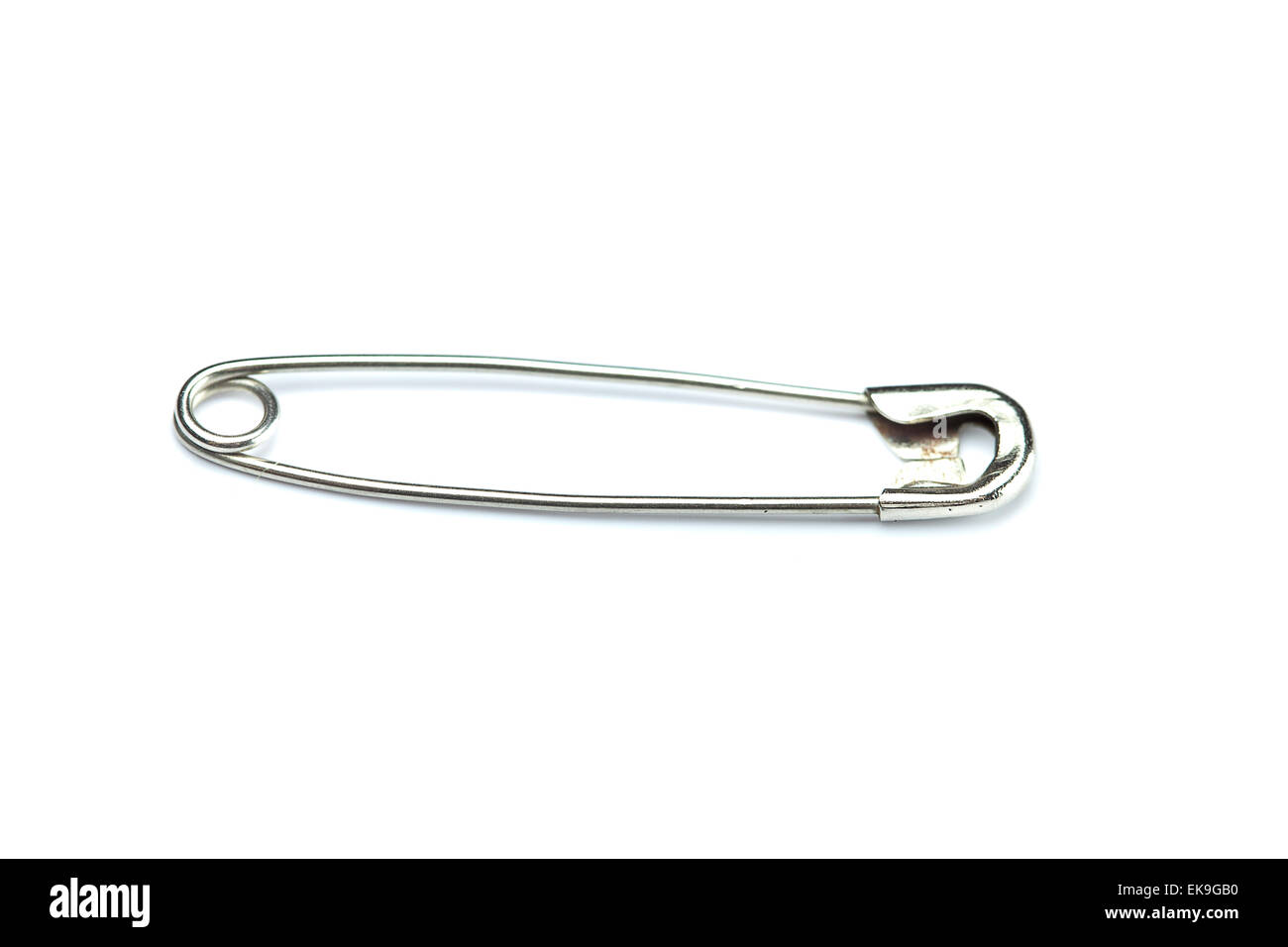 safety pin is isolated on a white Stock Photo - Alamy