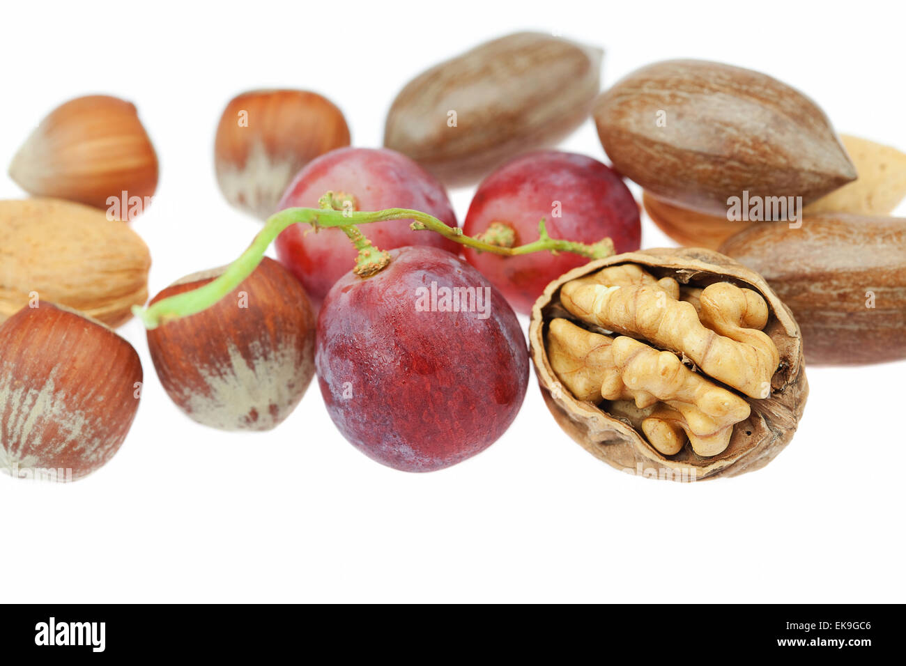 nuts and grapes isolated on white Stock Photo - Alamy