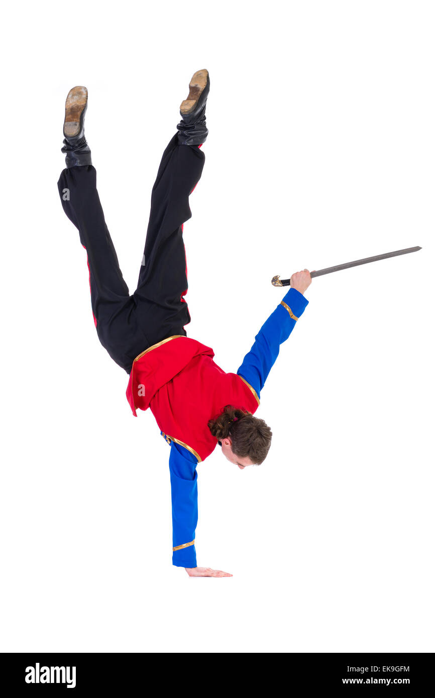 Russian cossack dance. Young dancer posing with sword Stock Photo - Alamy
