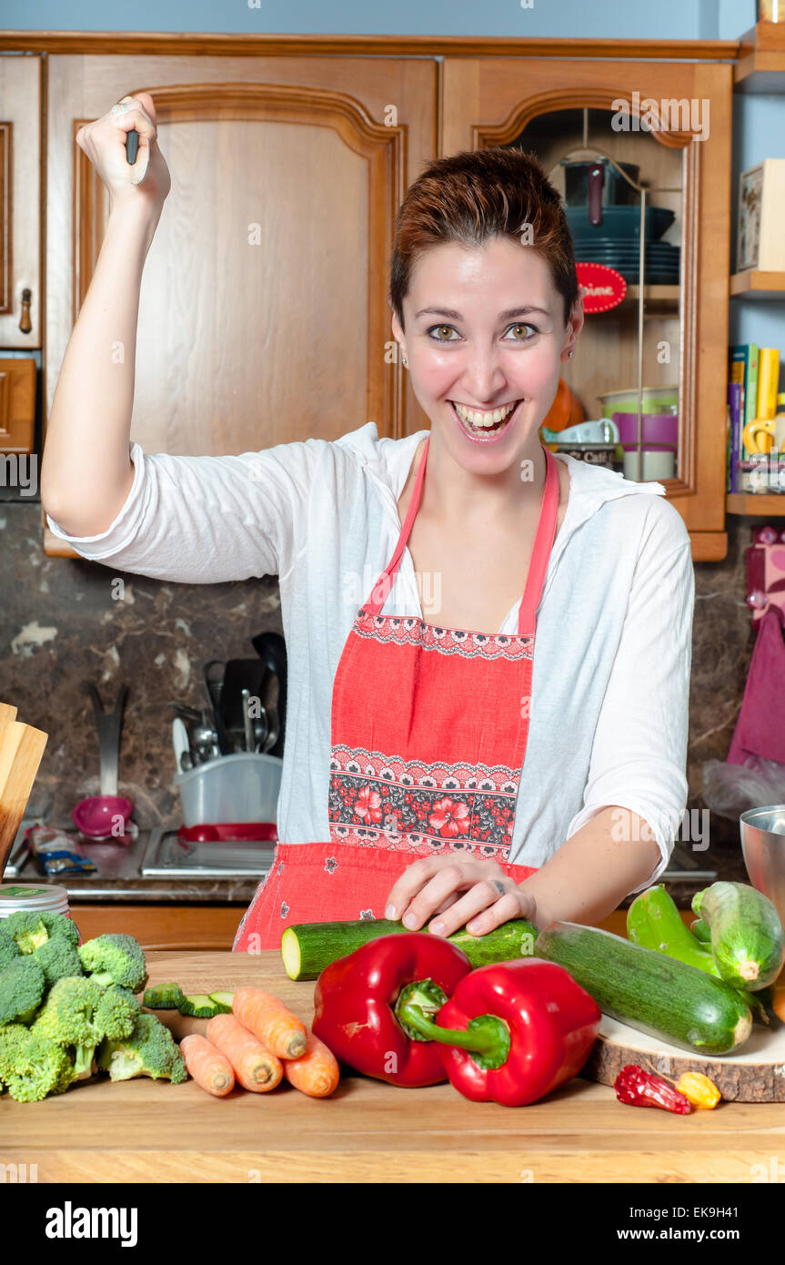 beautiful housewife cooking vegetables Stock Photo - Alamy