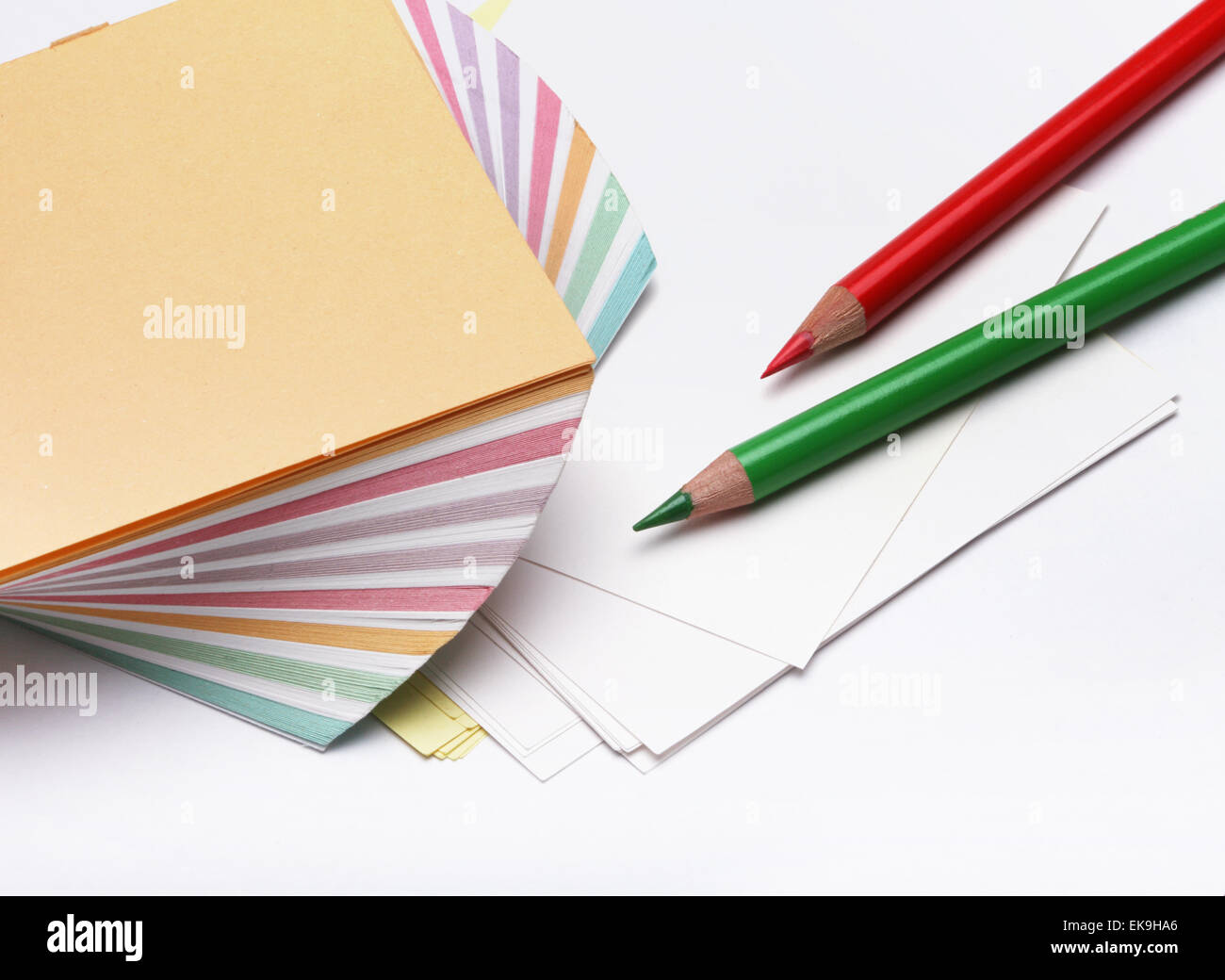 pencils and a stack of paper Stock Photo - Alamy