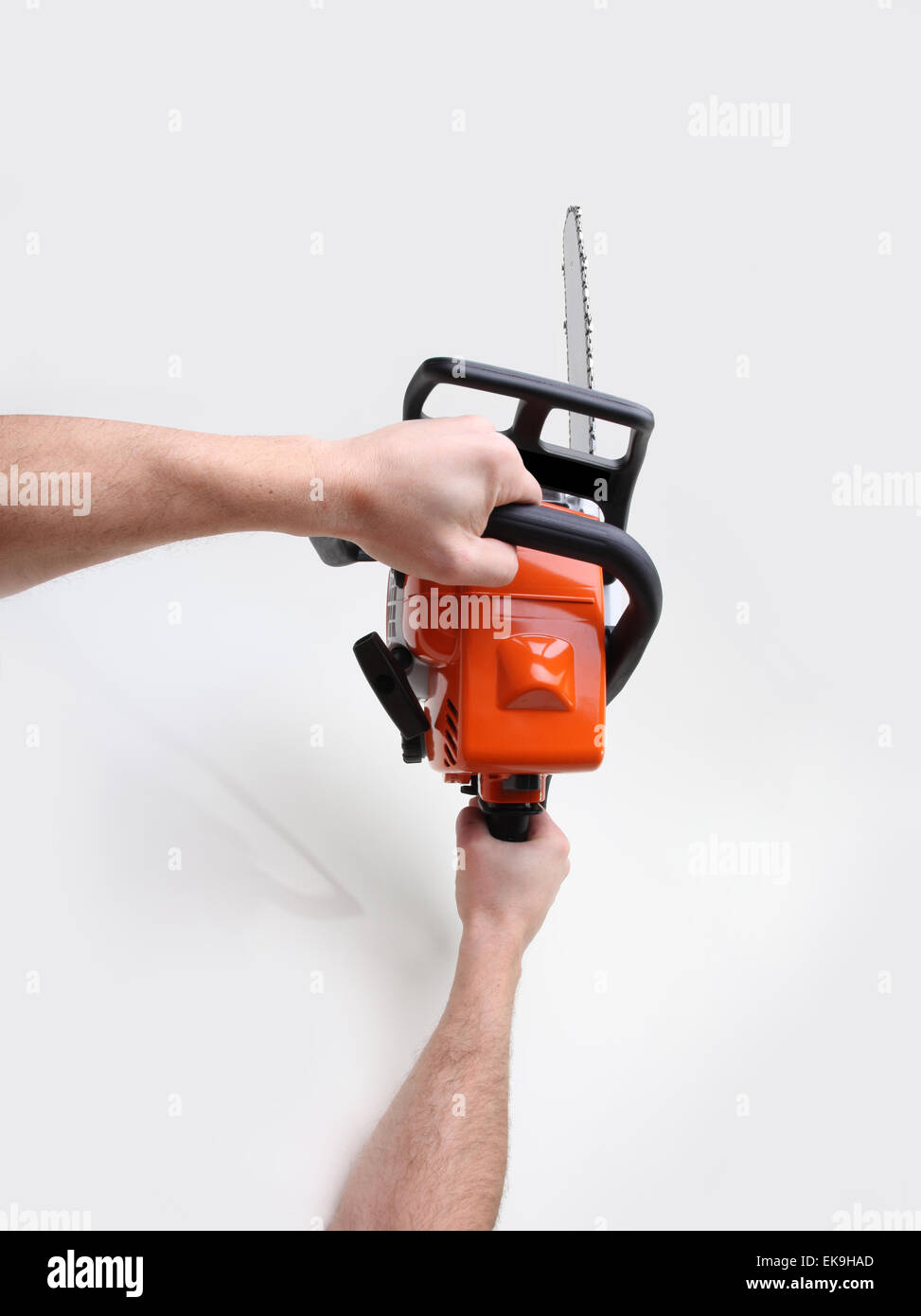 man hands holding a chainsaw Stock Photo - Alamy