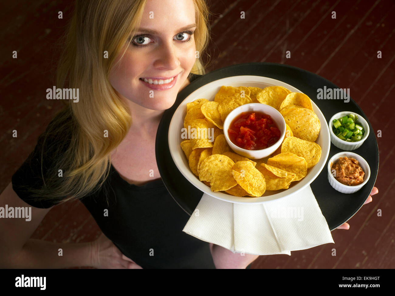 Young Attractive Female Server Brings Appetizer Chips Salsa Food Stock ...