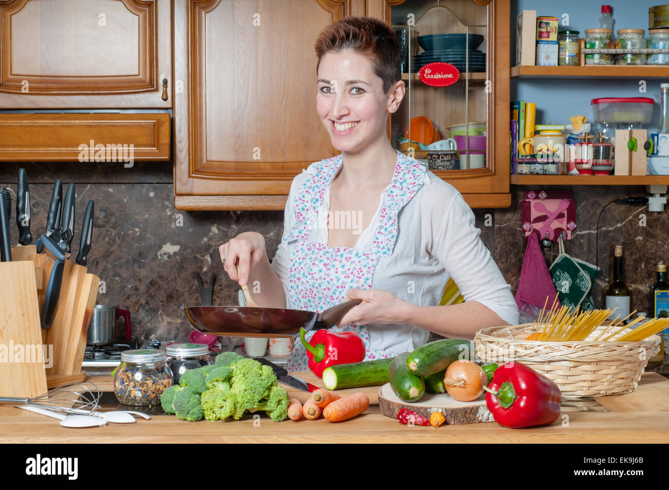 beautiful housewife cooking vegetables Stock Photo - Alamy