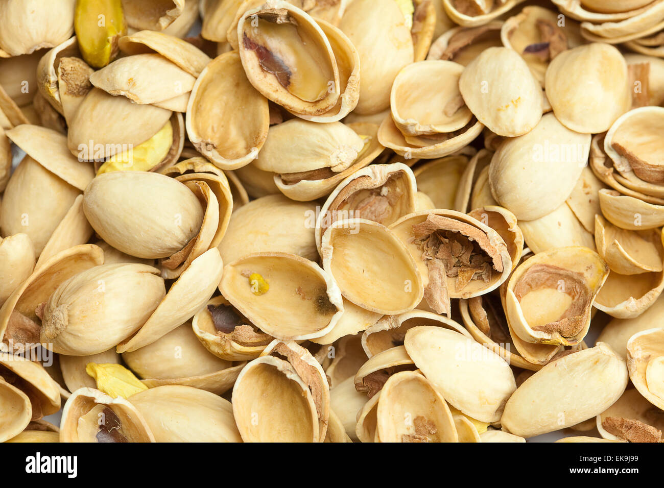 background from the shell of pistachio nuts Stock Photo - Alamy