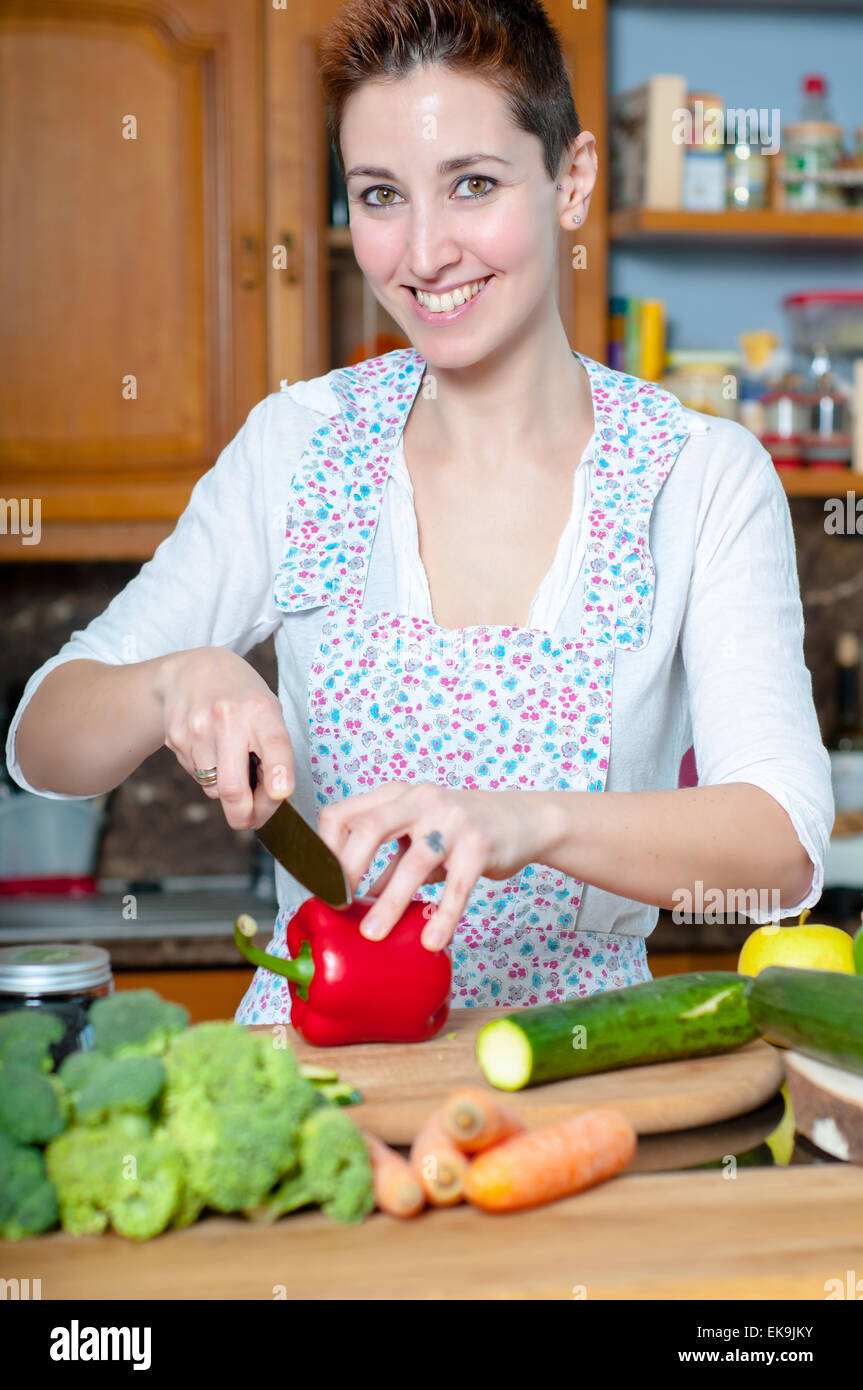 beautiful housewife cooking vegetables Stock Photo - Alamy