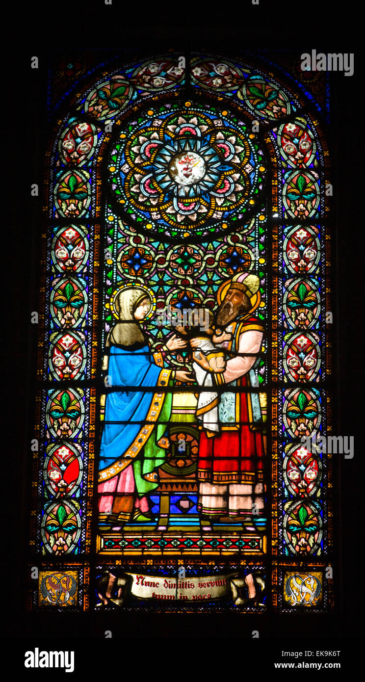 Stained glass window depicting a biblical scene: Presentation of Jesus ...