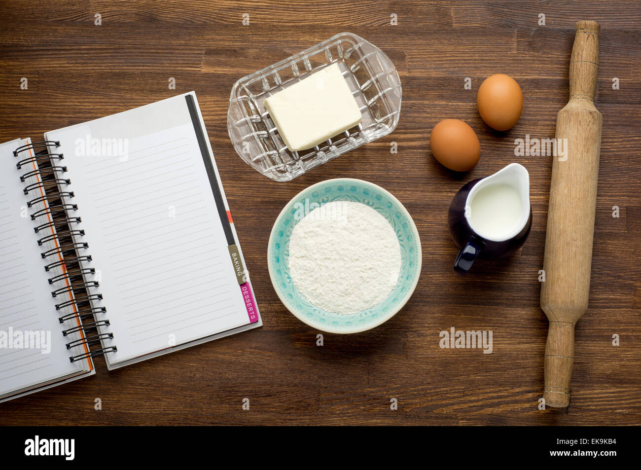 Ingredients for baking cake (eggs, flour, milk, butter) on vintage ...