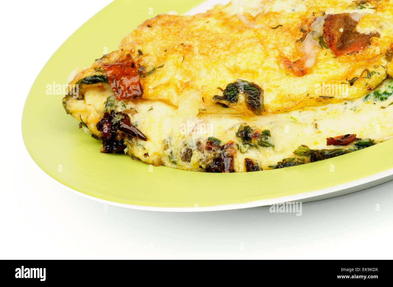 Omelet with Tomatoes and Greens Stock Photo - Alamy