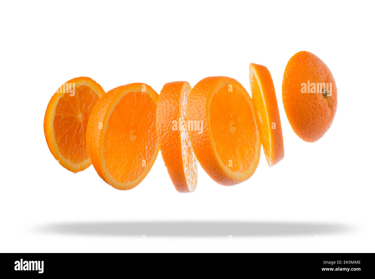 Falling slices of orange in air isolated on white Stock Photo - Alamy