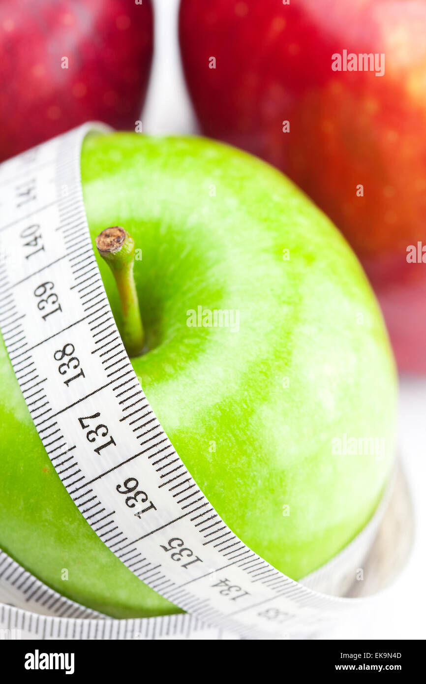 apple and measure tape isolated on white Stock Photo - Alamy