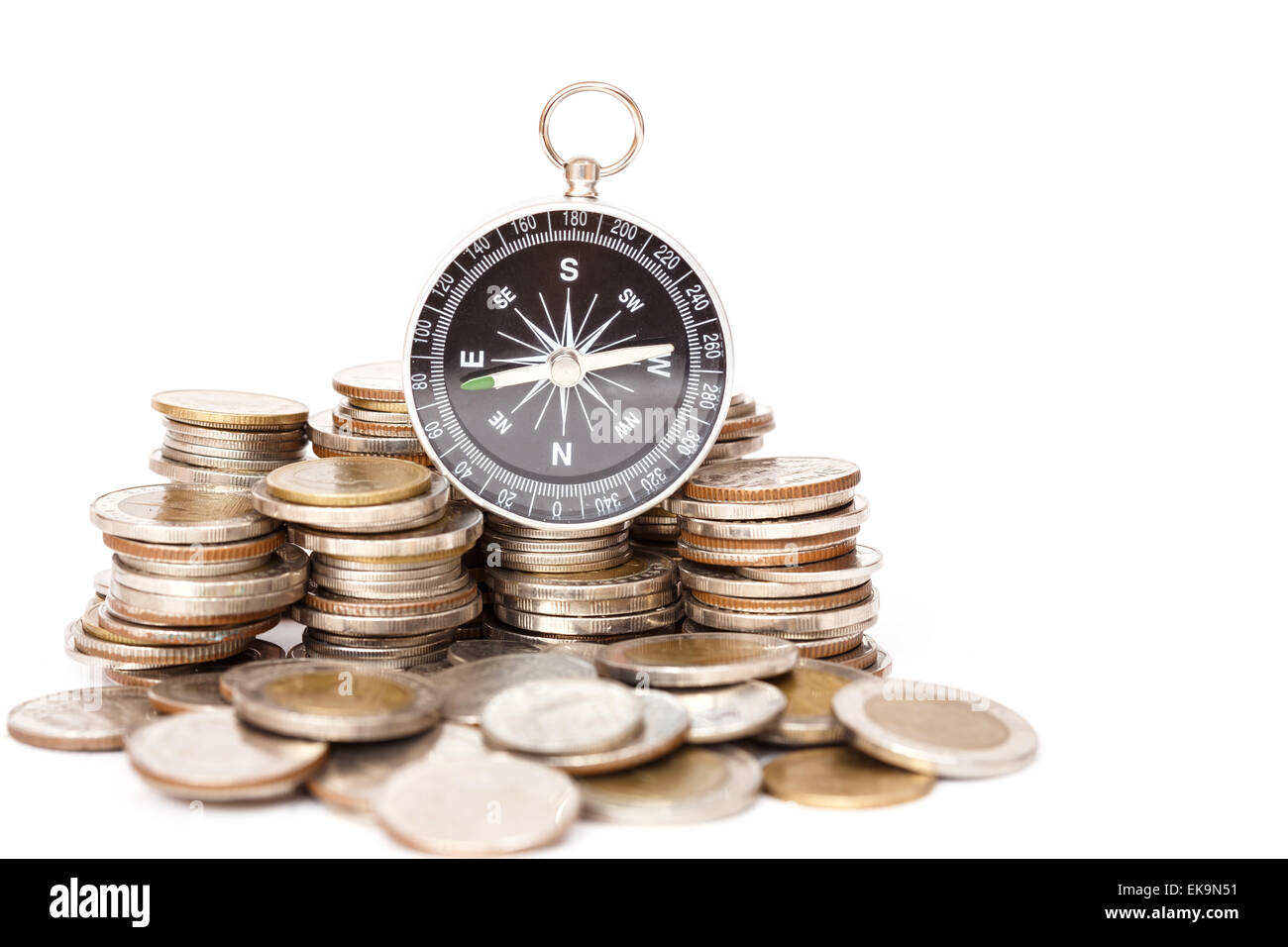 Close up Compass on coin stack Stock Photo - Alamy
