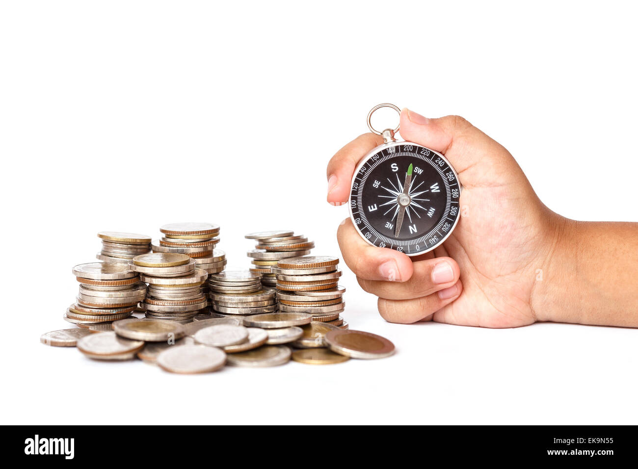 Close up hand holding compass and coin stack, business concept Stock ...