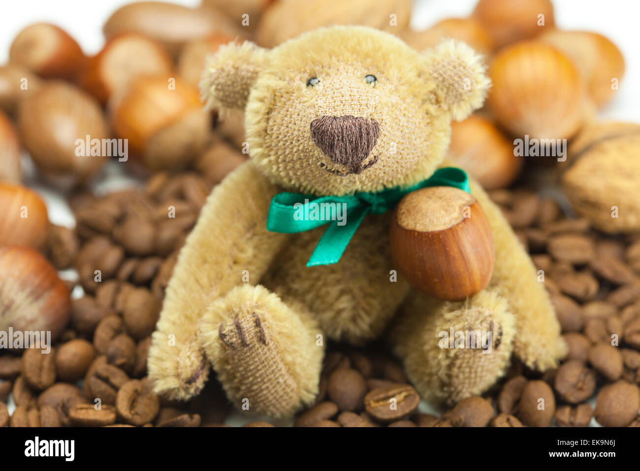 teddy bear with a bow, coffee beans and nuts Stock Photo - Alamy
