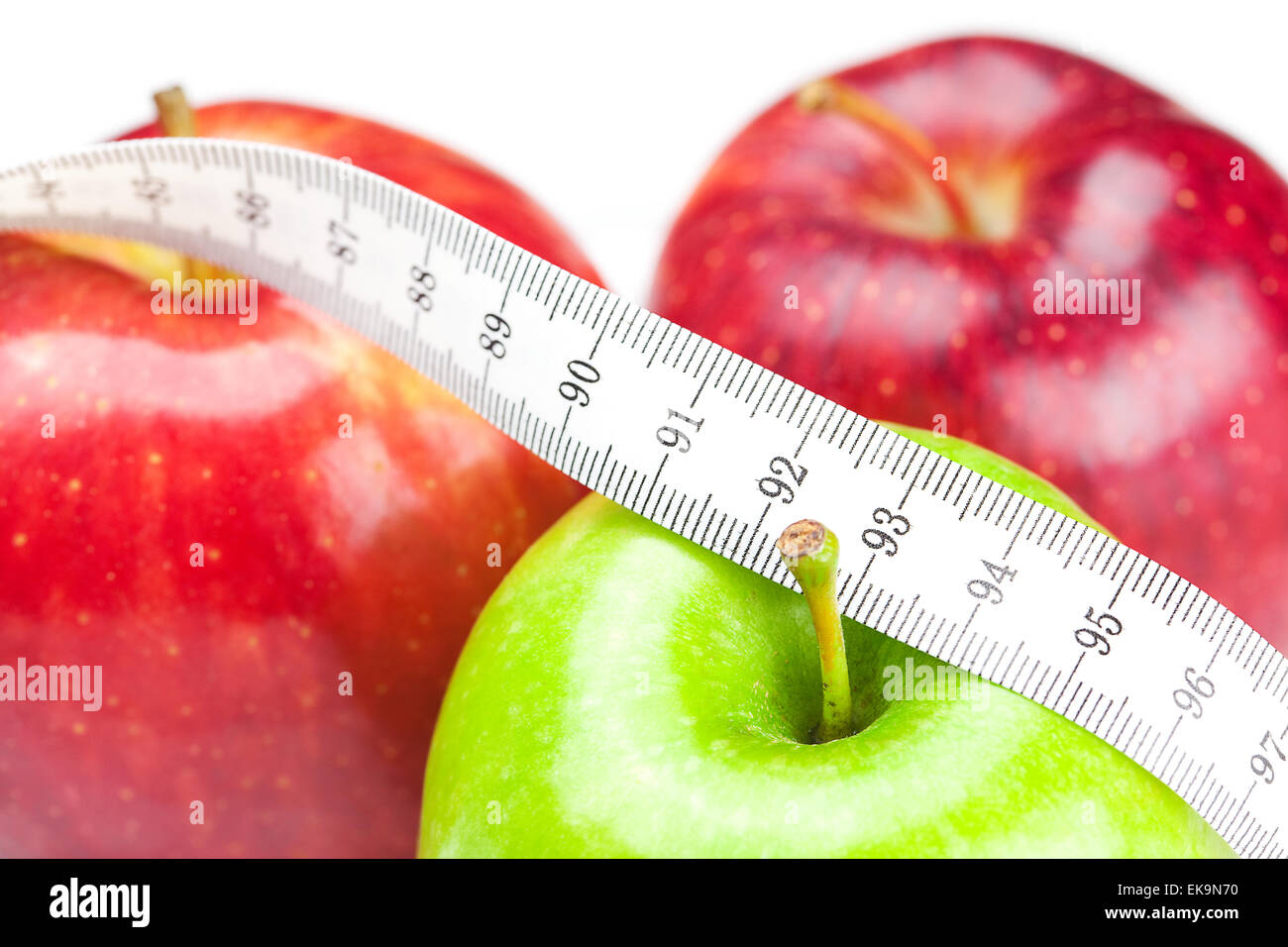 apple and measure tape isolated on white Stock Photo - Alamy