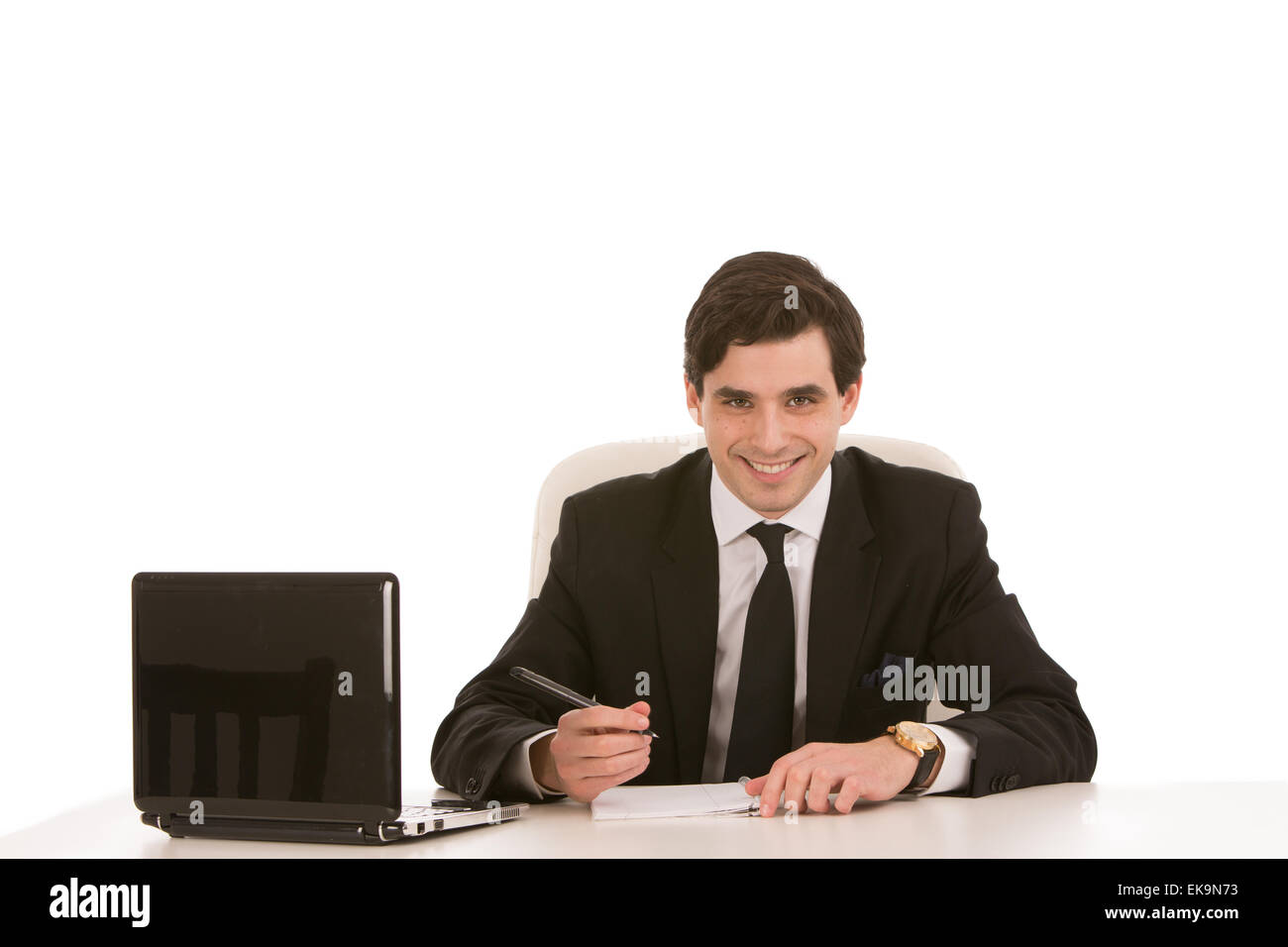 Businessman writing at his desk Stock Photo - Alamy