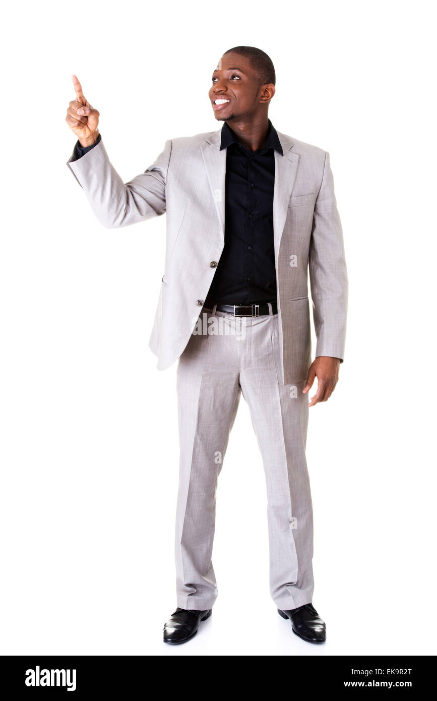 Cheerful black man pointing looking Cut Out Stock Images & Pictures - Alamy