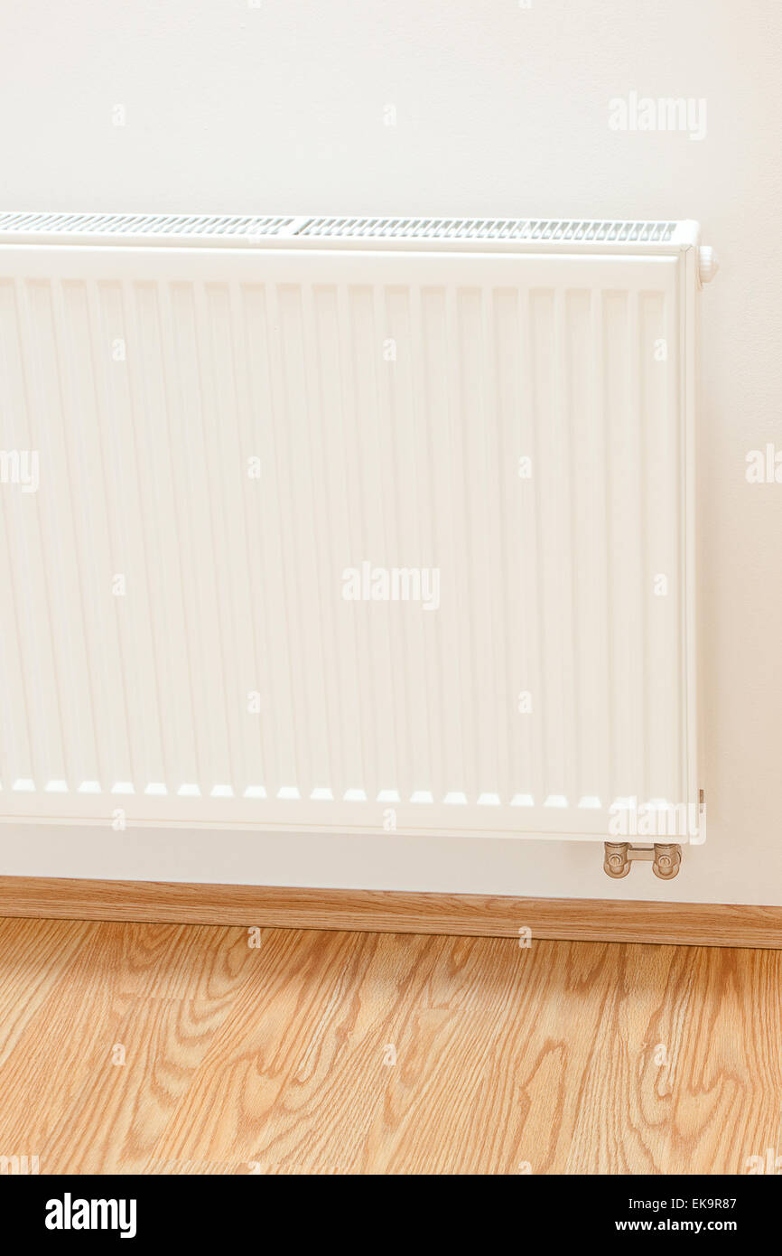 radiator hanging on the wall in the room Stock Photo - Alamy