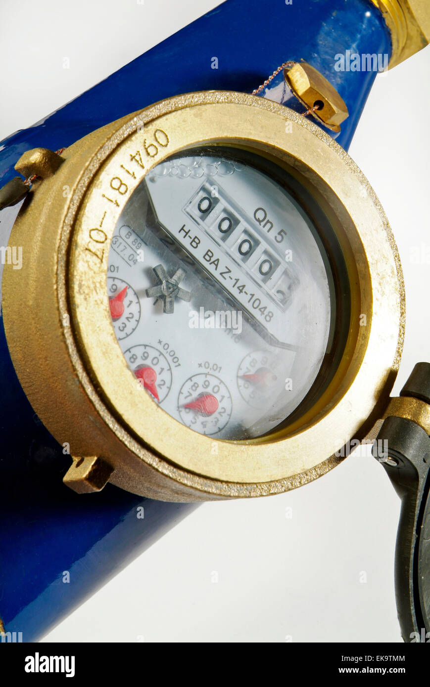 detail of water meter and industrial liquids on a white background ...