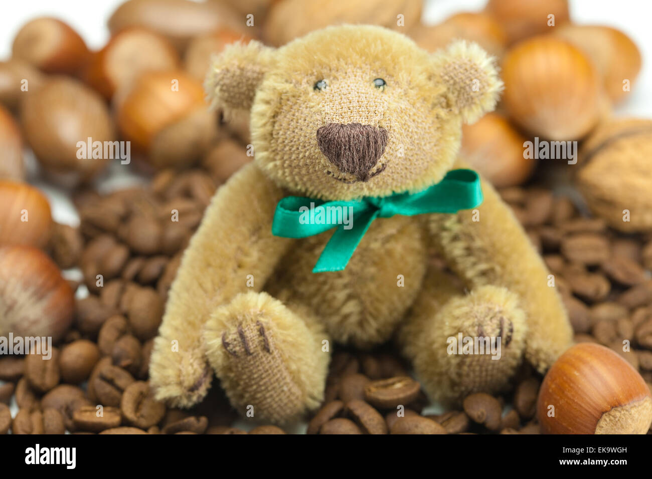 teddy bear with a bow, coffee beans and nuts Stock Photo - Alamy