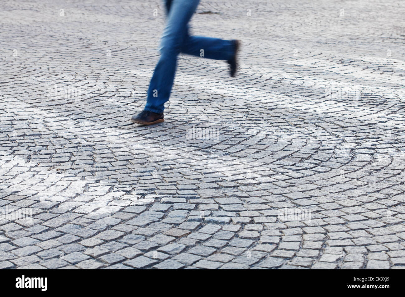 man running at a pedestrian crossing Stock Photo - Alamy