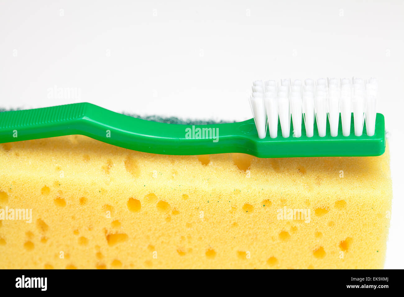 sponge for washing dishes and toothbrush isolated on white Stock Photo ...