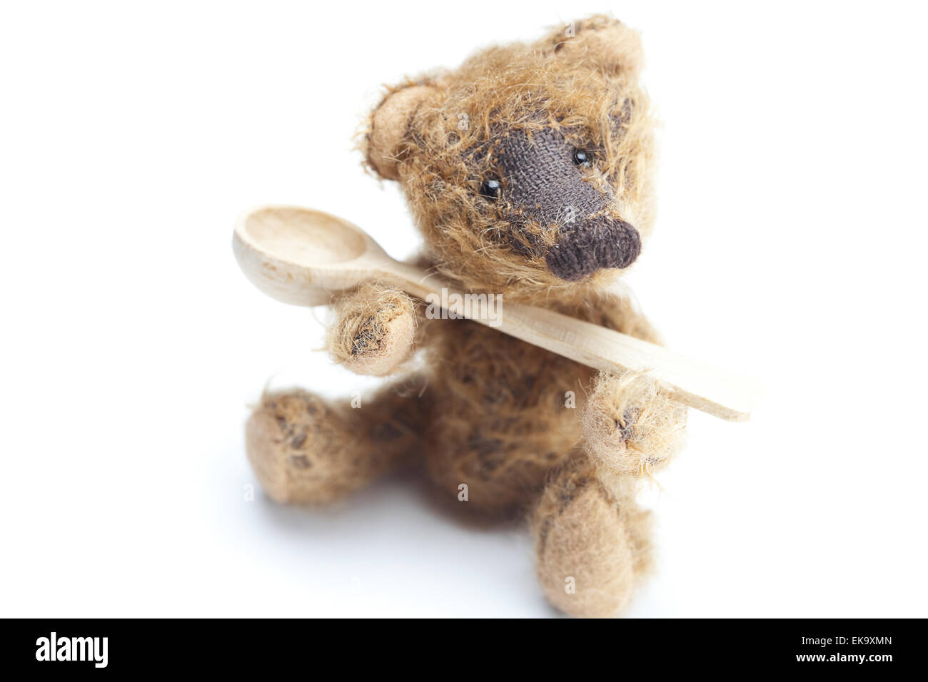 Teddy Bear and a wooden spoon isolated on white Stock Photo - Alamy