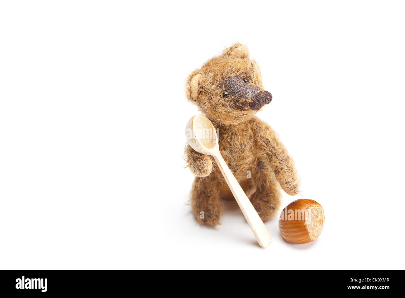 Teddy Bear, nuts and wooden spoon isolated on white Stock Photo - Alamy