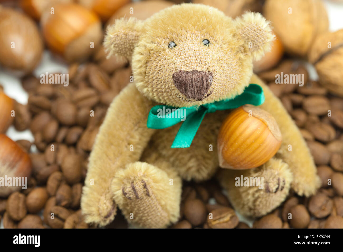 teddy bear with a bow, coffee beans and nuts Stock Photo - Alamy