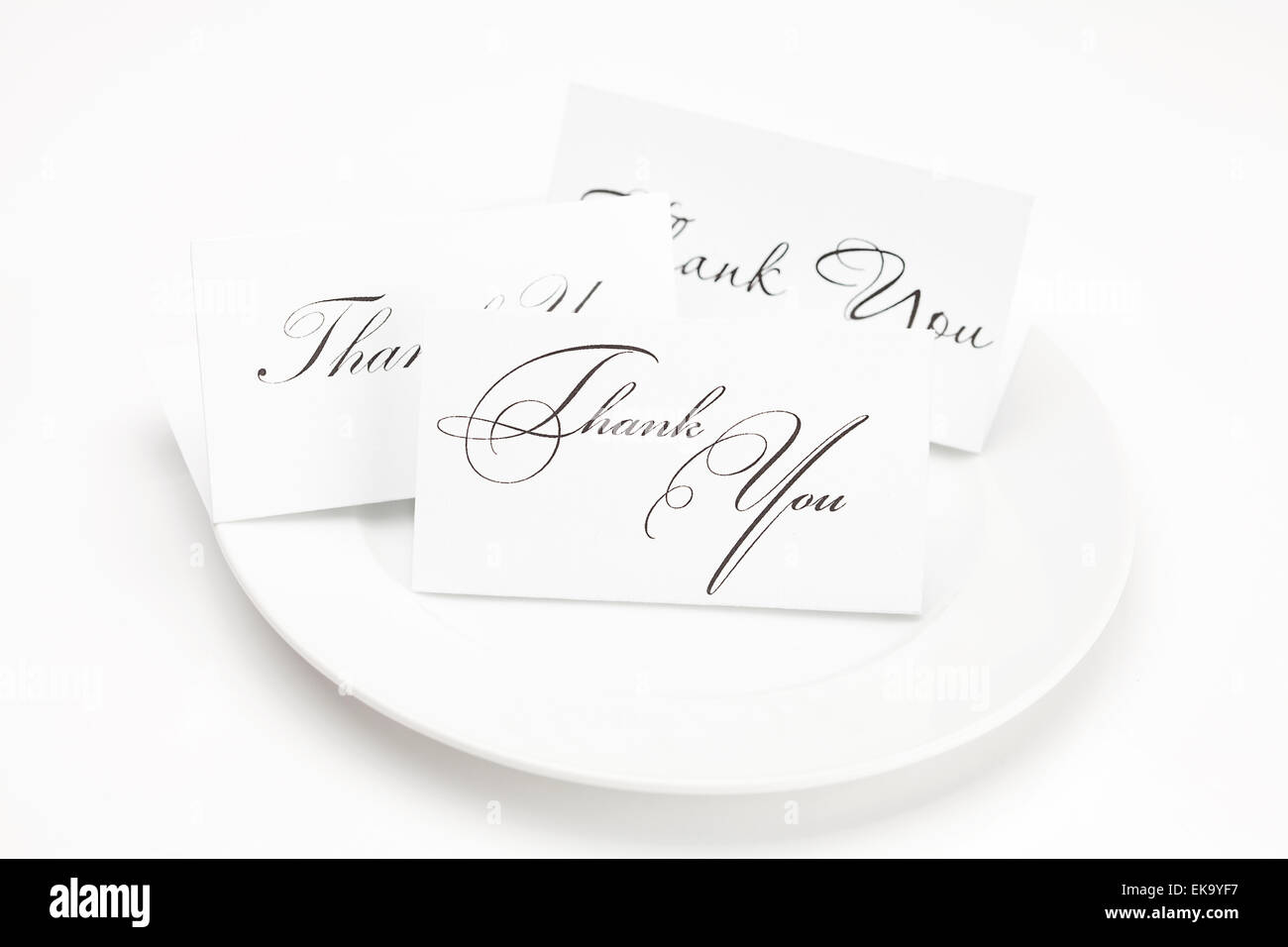 plate with card signed thank you isolated on white Stock Photo - Alamy
