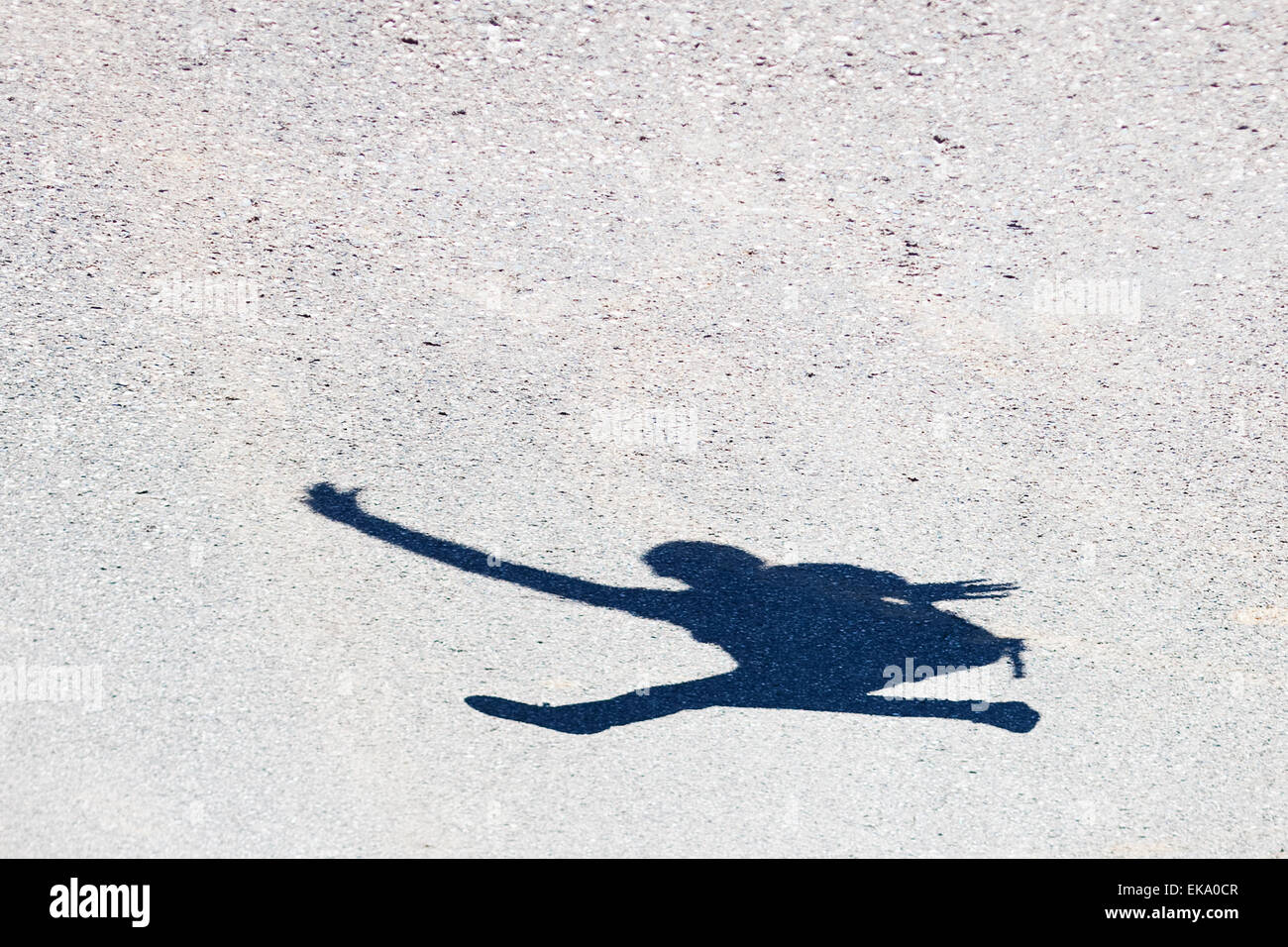 shadow of a man jumping on the asphalt Stock Photo - Alamy