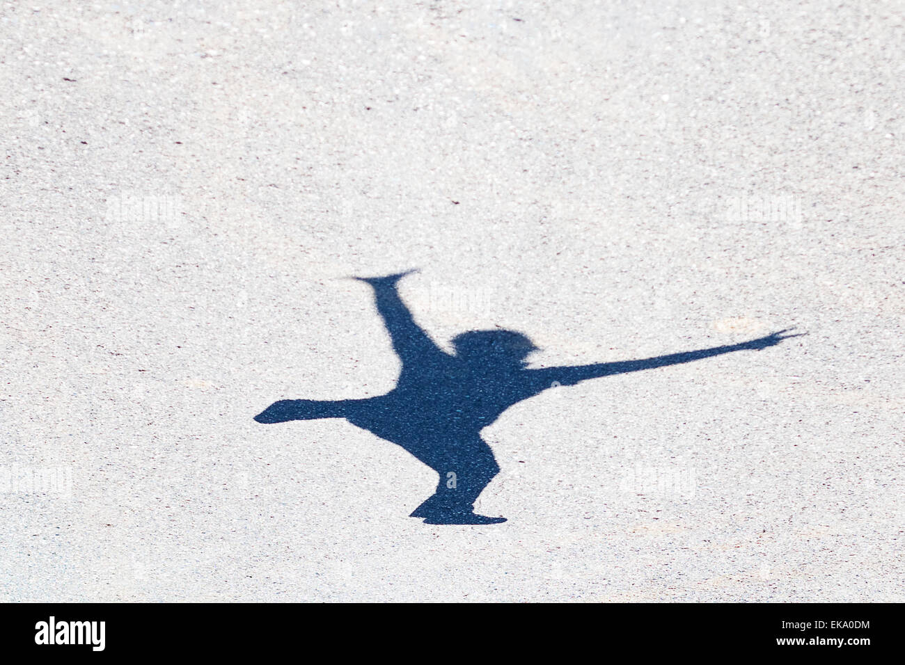 shadow of a man jumping on the asphalt Stock Photo - Alamy