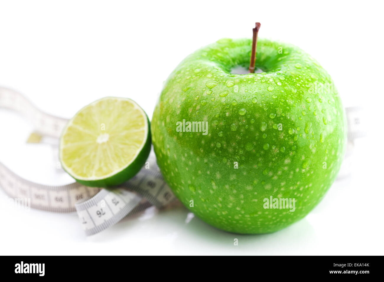 apple,lime and measure tape isolated on white Stock Photo - Alamy