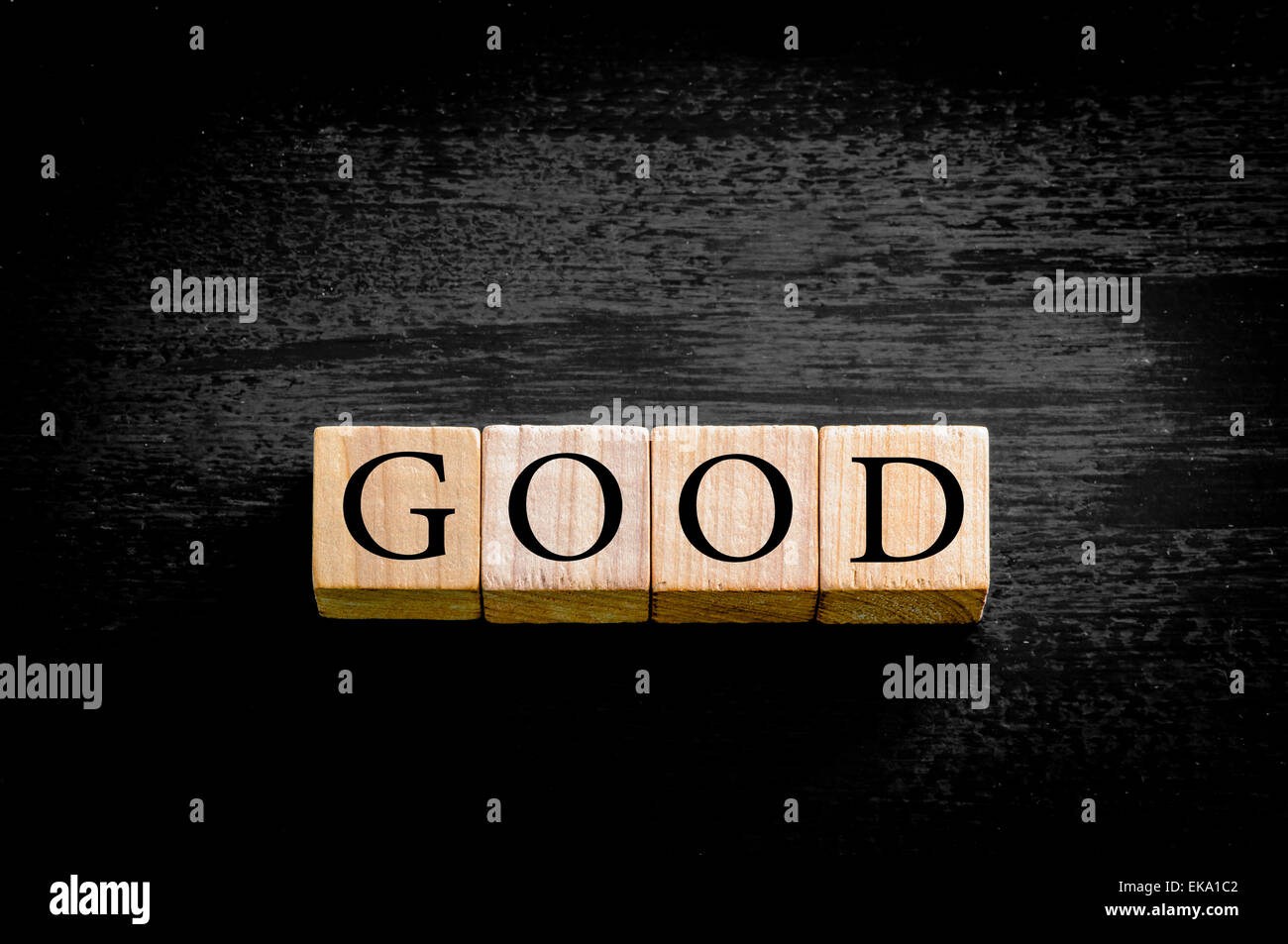Word GOOD. Wooden small cubes with letters isolated on black background ...