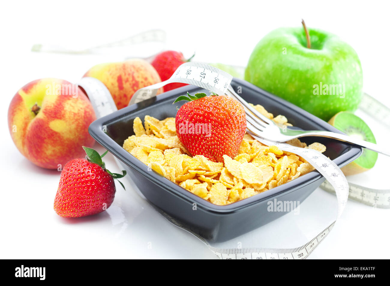 strawberry, peach, apple, kiwi, fork, measure tape and flakes in Stock ...