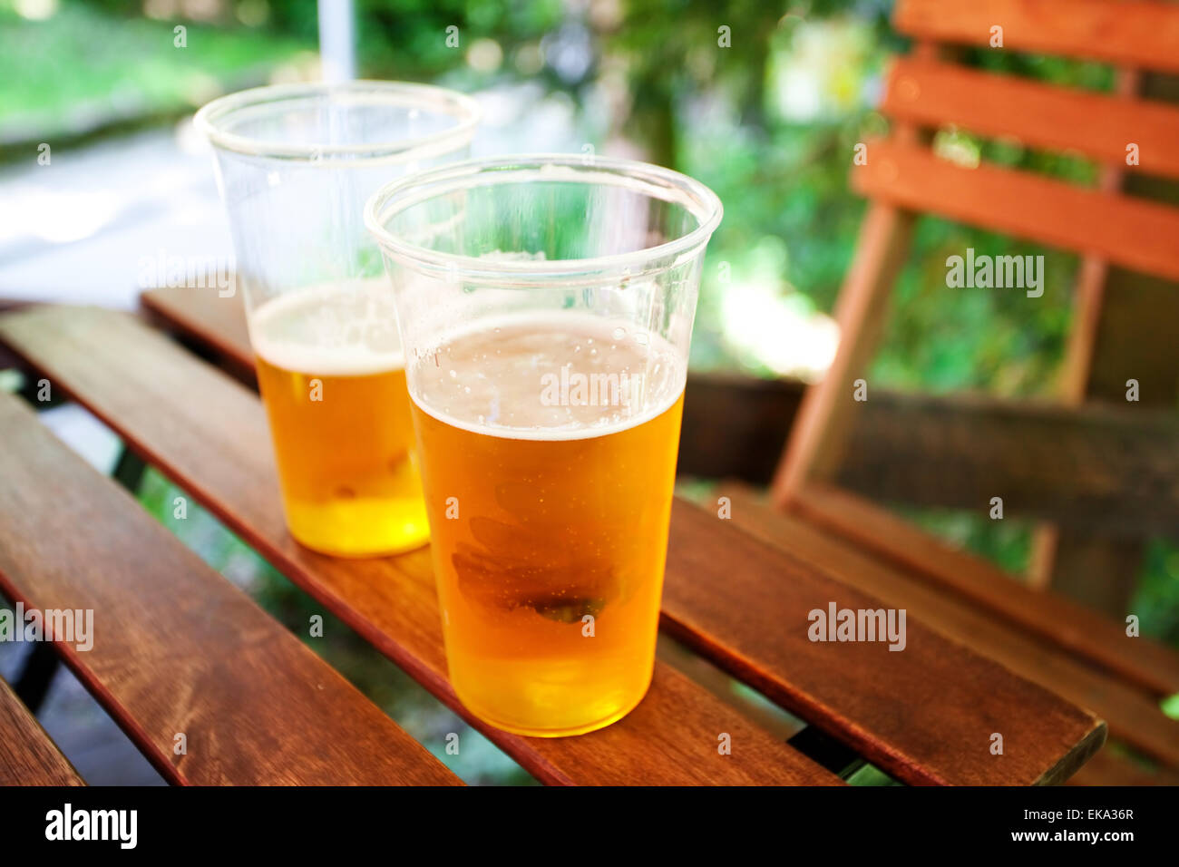 glass of beer standing on a wooden table Stock Photo - Alamy