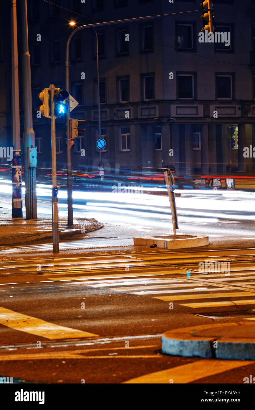 strip from passing cars and traffic lights at night street Stock Photo ...