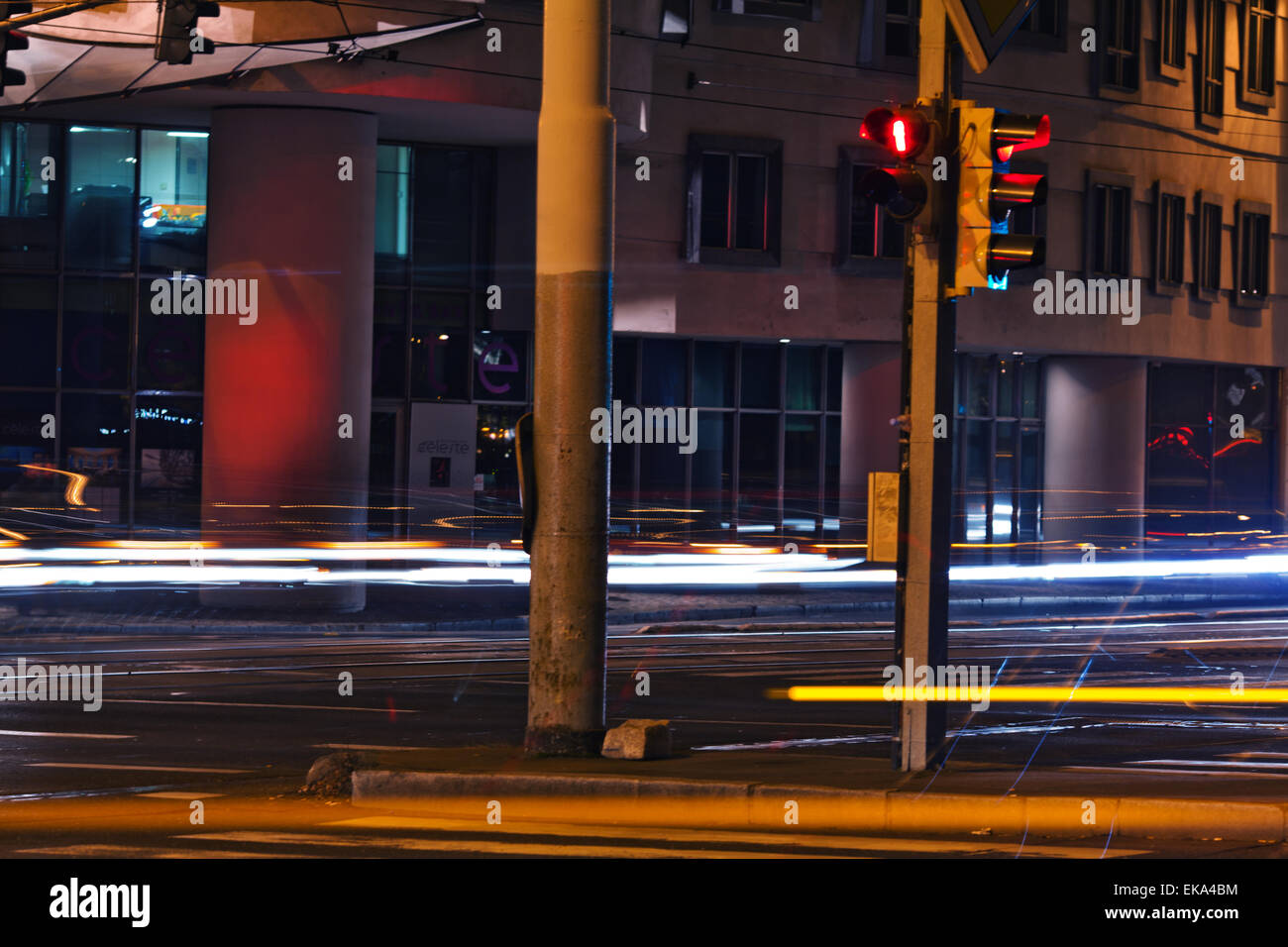 strip from passing cars and traffic lights at night street Stock Photo ...