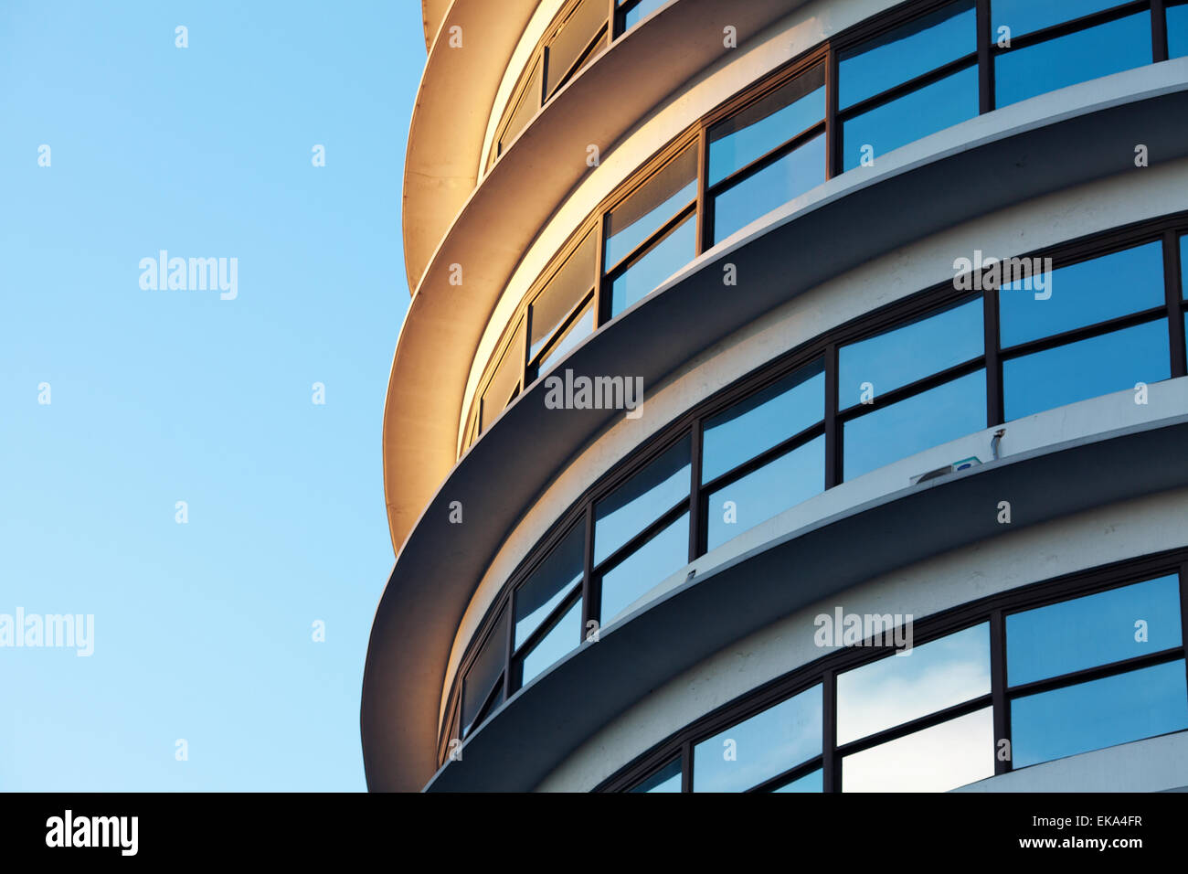Beautiful modern office building against the blue sky Stock Photo - Alamy