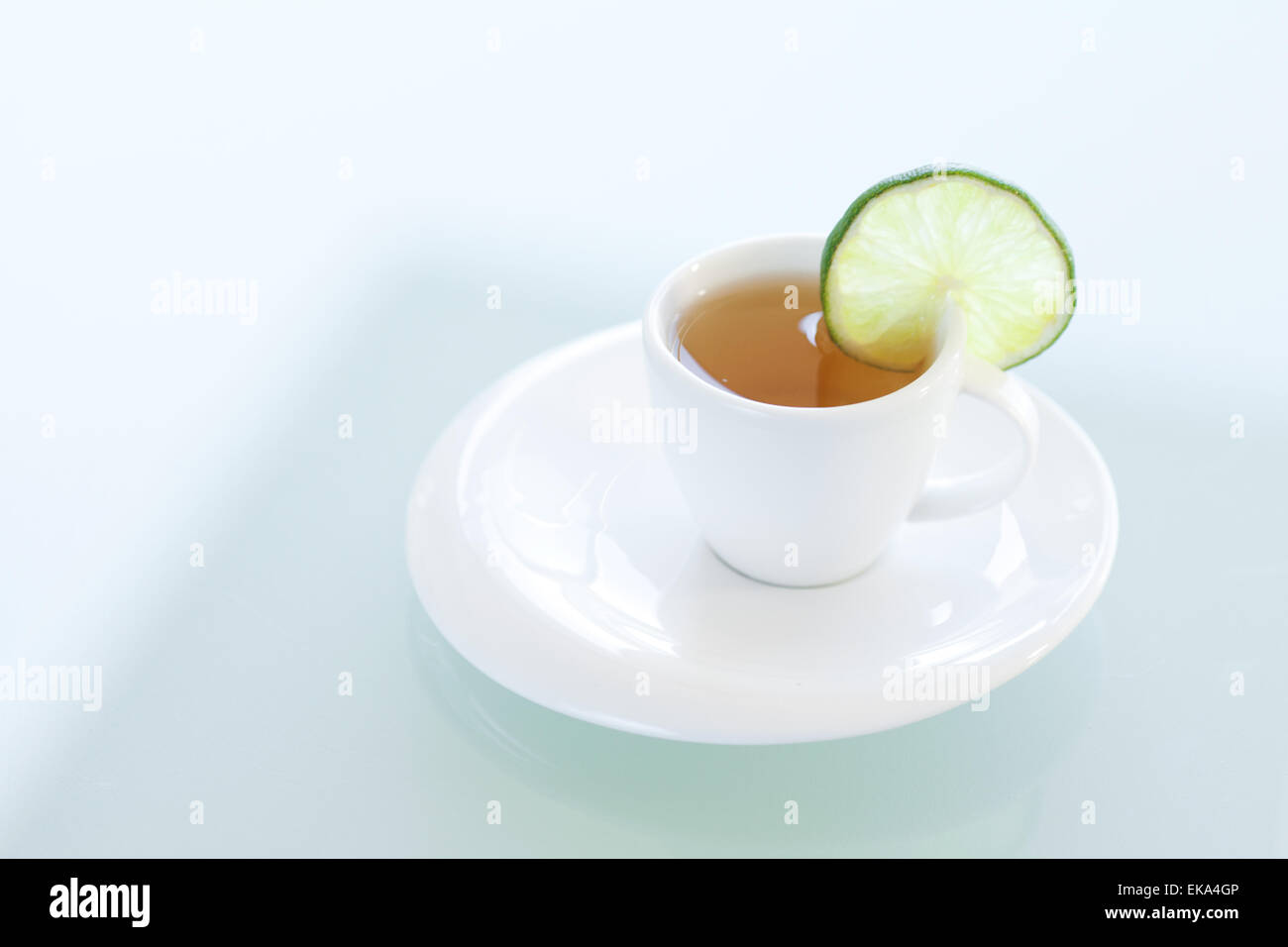 cup of tea with lime on a glass surface Stock Photo - Alamy