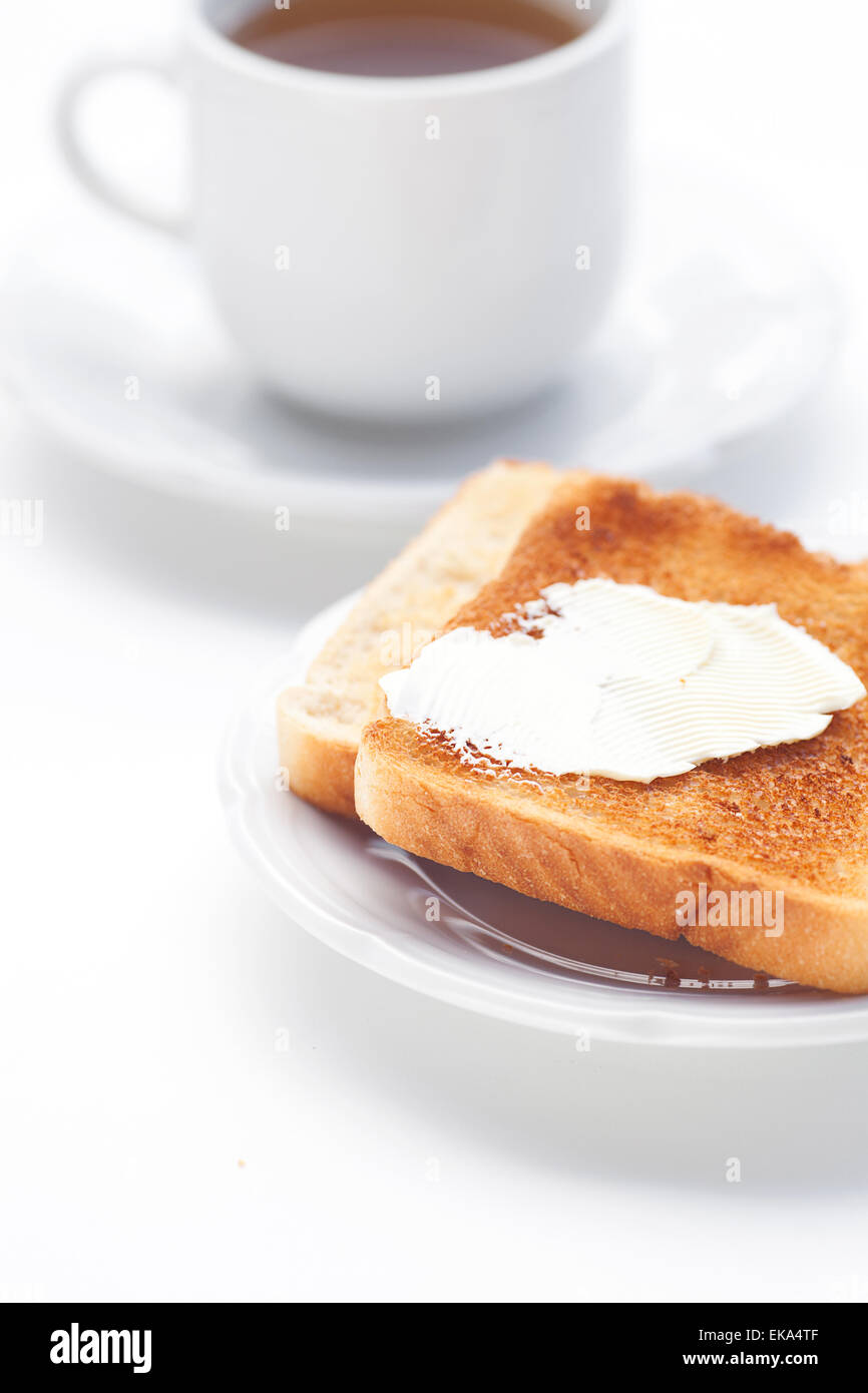 tea and toast with butter isolated on white Stock Photo - Alamy
