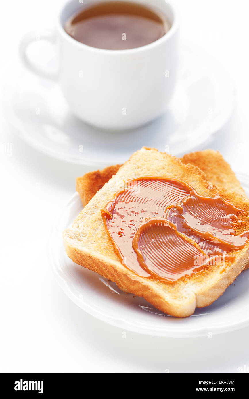 tea and toast with caramel isolated on white Stock Photo - Alamy