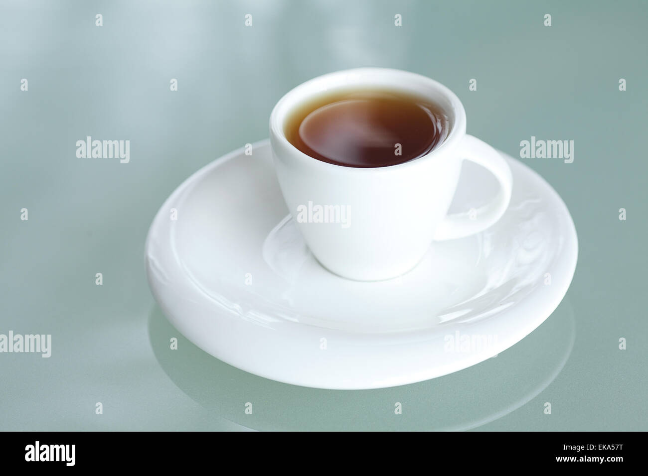 cup of tea on a glass surface Stock Photo - Alamy