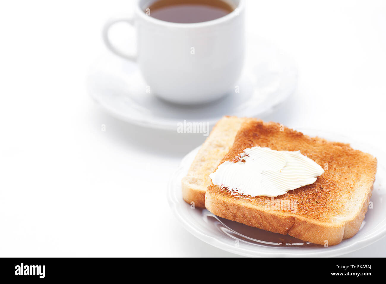 tea and toast with butter isolated on white Stock Photo - Alamy