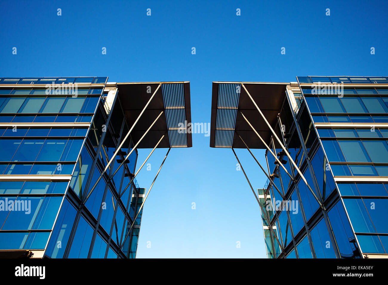 Beautiful modern office building against the blue sky Stock Photo - Alamy